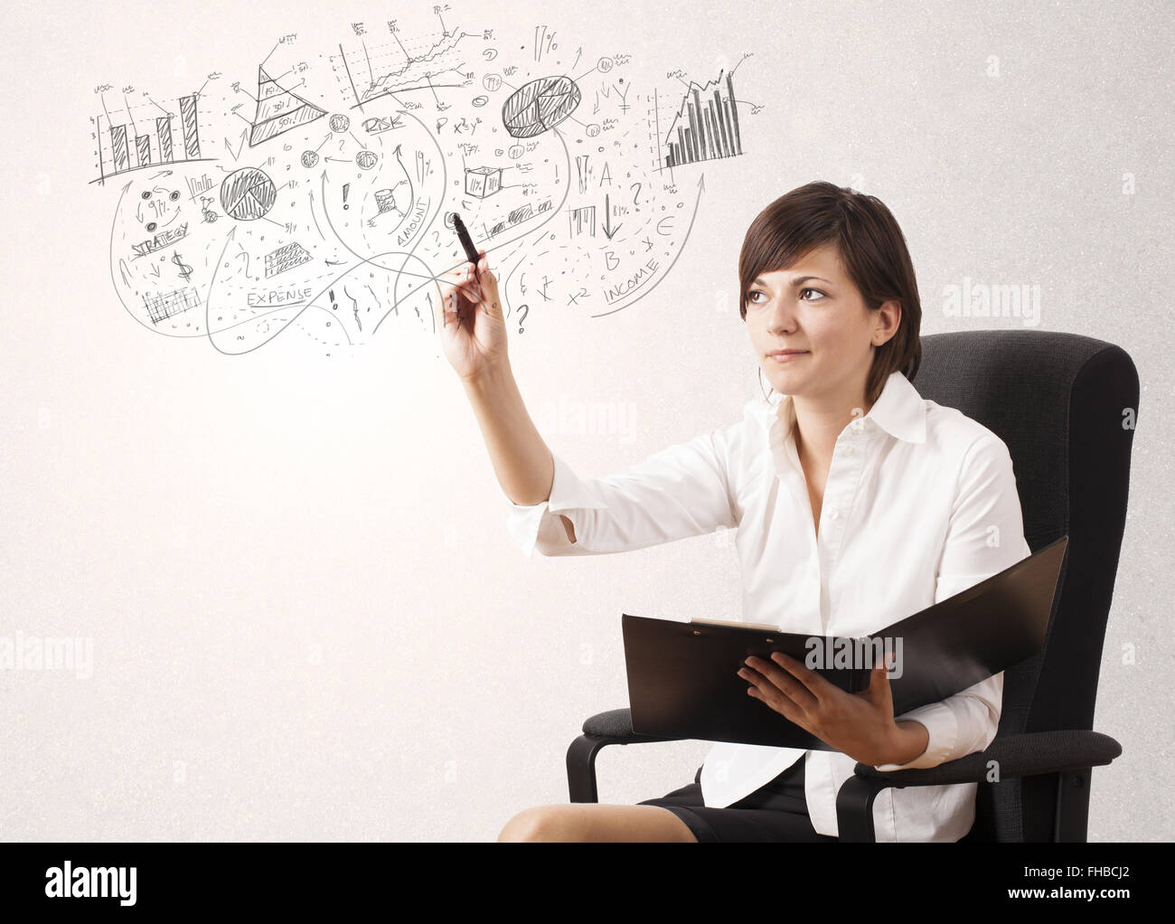 Pretty girl sketching graphs and diagrams on wall Stock Photo - Alamy