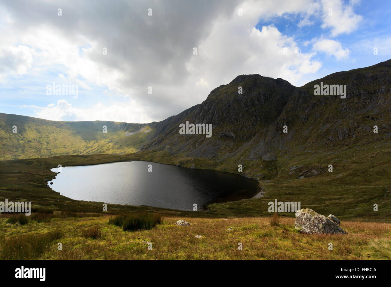 Llyn Dyfi, source of the River Dyfi which sits below the summit of Aran ...