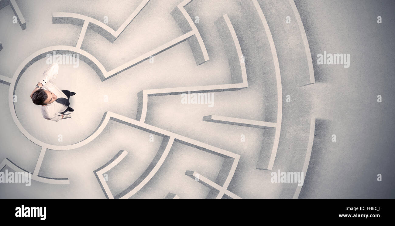Business man trapped in a circular maze Stock Photo - Alamy