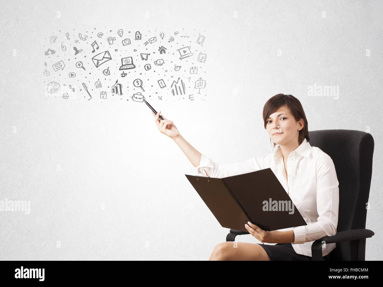 Young woman drawing and sketching icons and symbols Stock Photo - Alamy