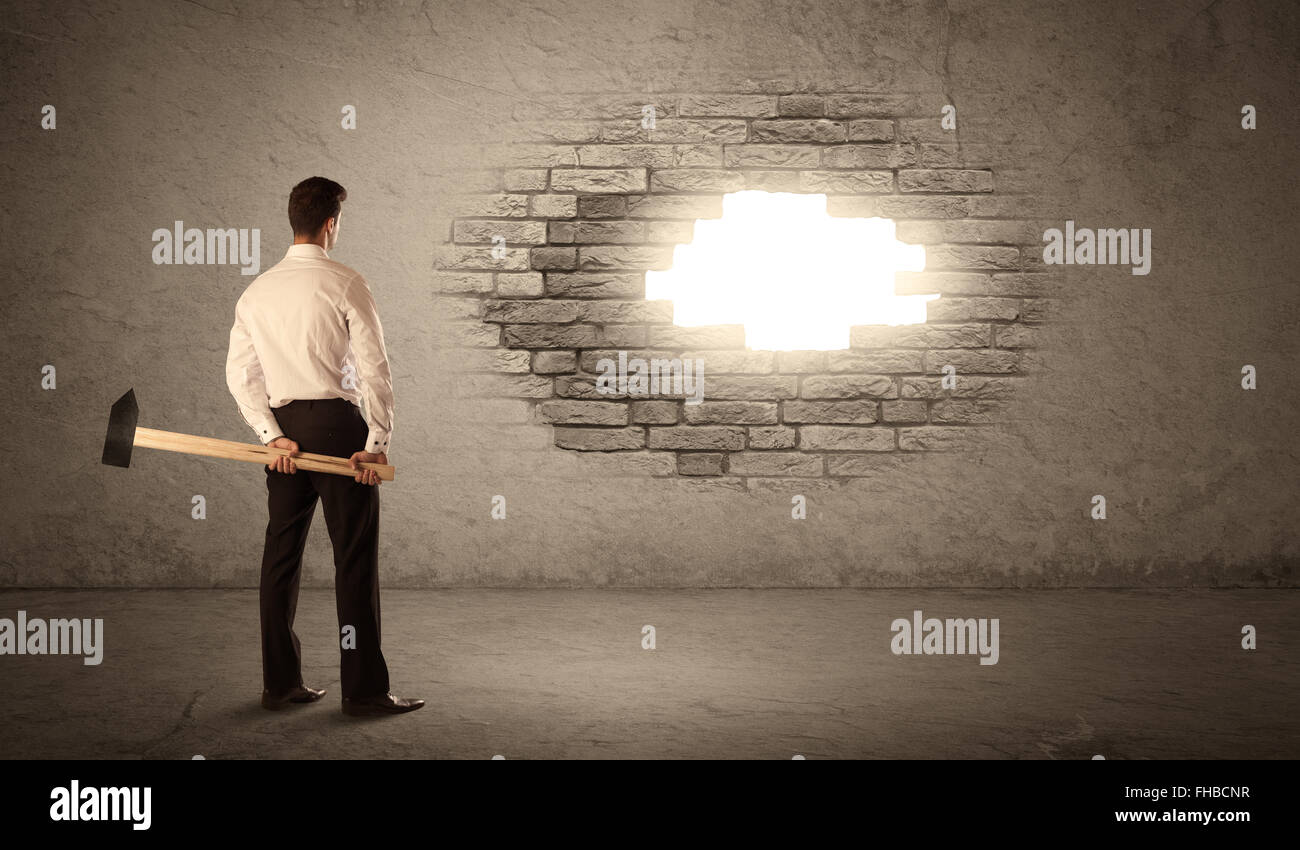 Breaking through brick wall hi-res stock photography and images - Alamy