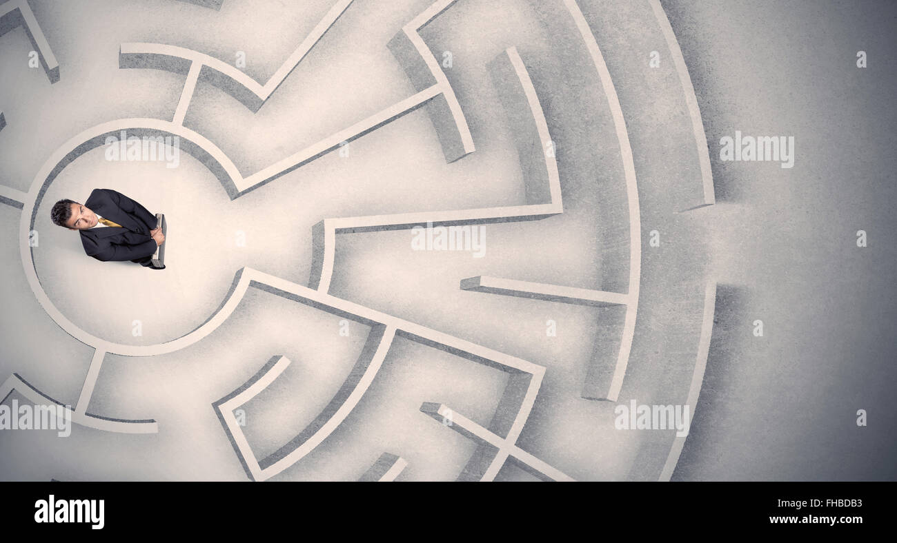 Business man trapped in a circular maze Stock Photo - Alamy