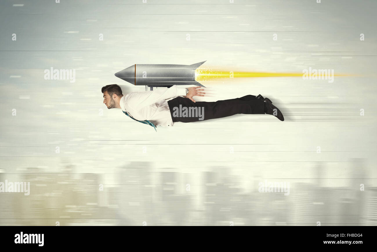 Superhero business man flying with jet pack rocket above the city Stock ...