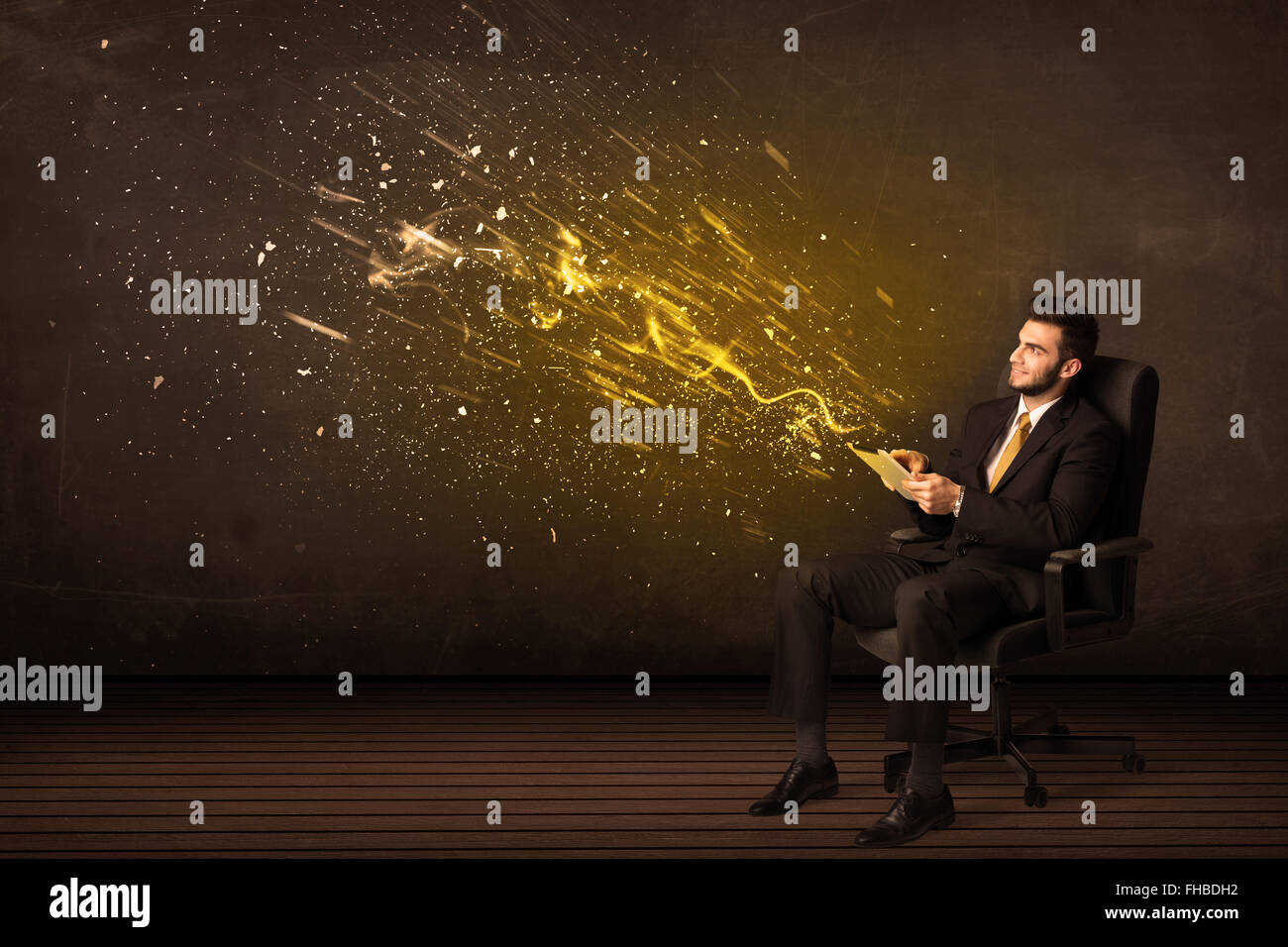 Businessman with tablet and energy explosion on background Stock Photo ...