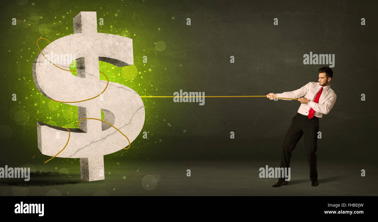 Business man pulling a big green dollar sign Stock Photo - Alamy