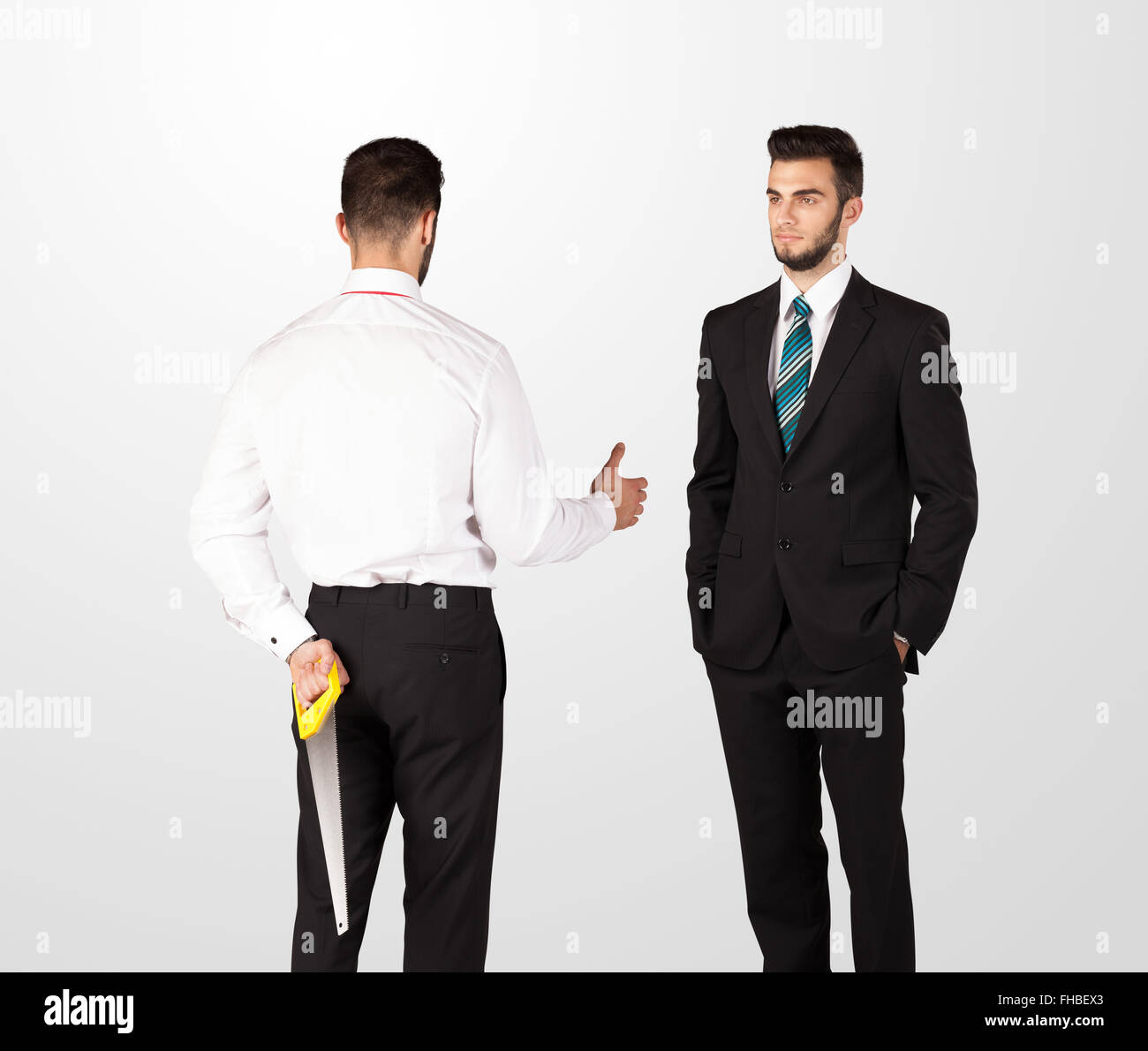 Two businessman shake hands Stock Photo - Alamy