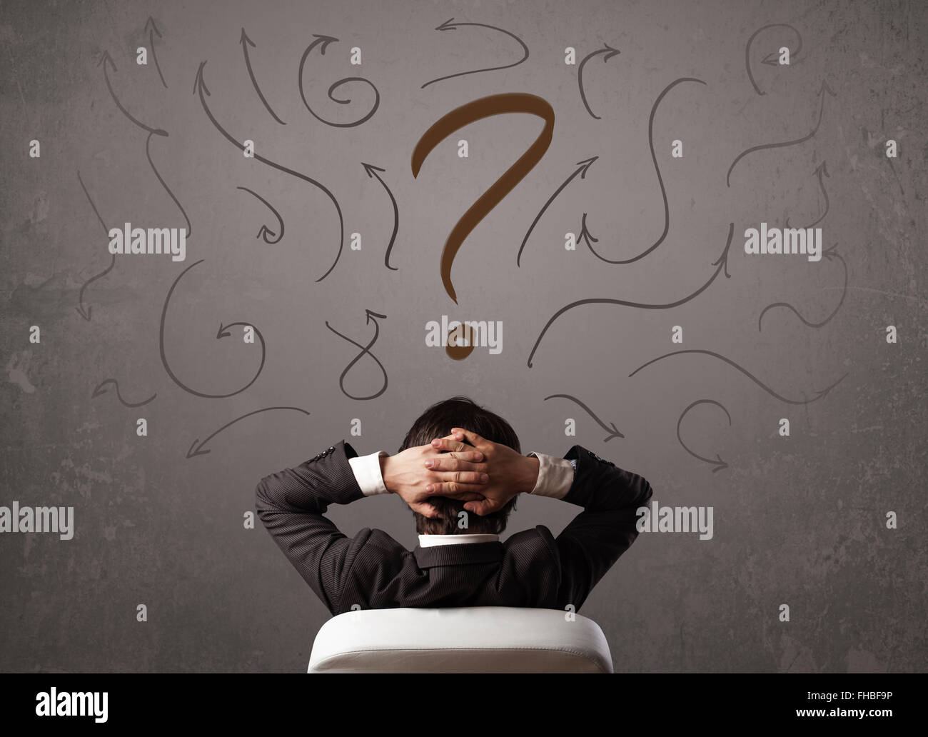 Business man looking at question mark sketch Stock Photo - Alamy