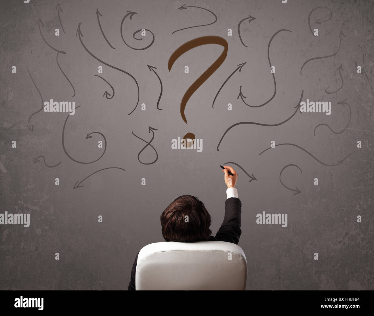 Business man looking at question mark sketch Stock Photo - Alamy
