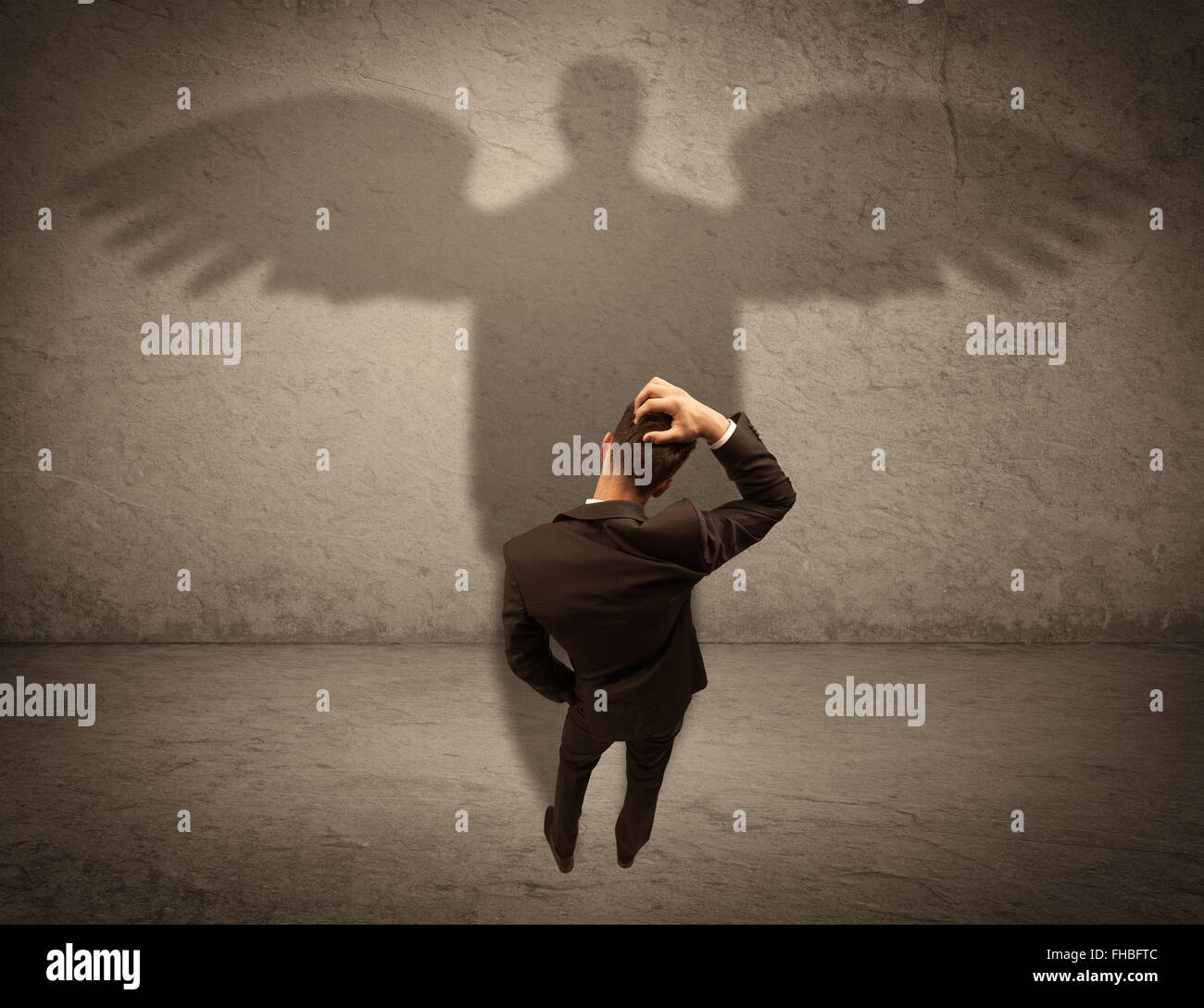 Business man angel shadow hi-res stock photography and images - Alamy