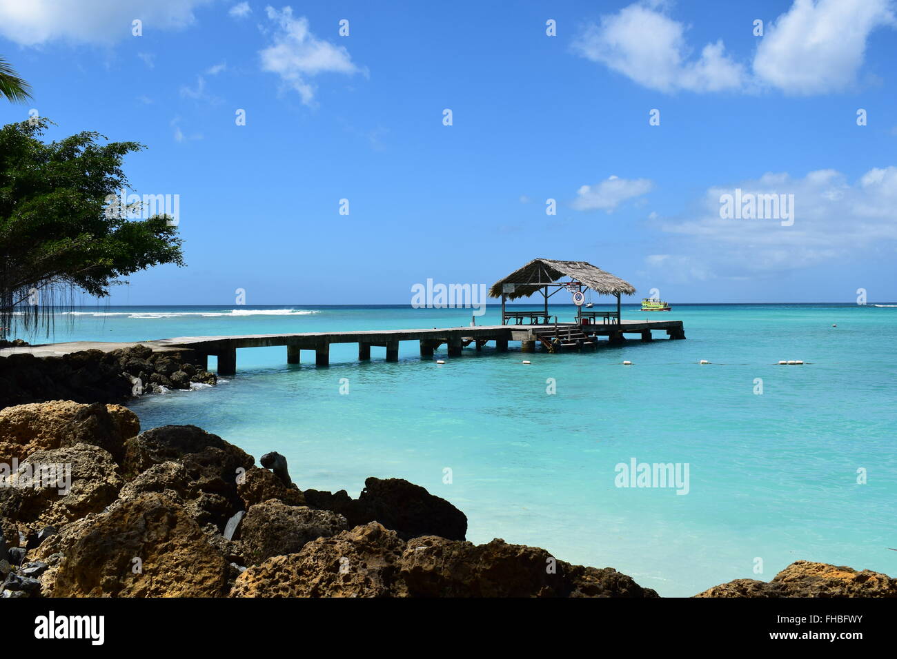 The thatched roof jetty at Pigeon Point, Tobago Stock Photo - Alamy