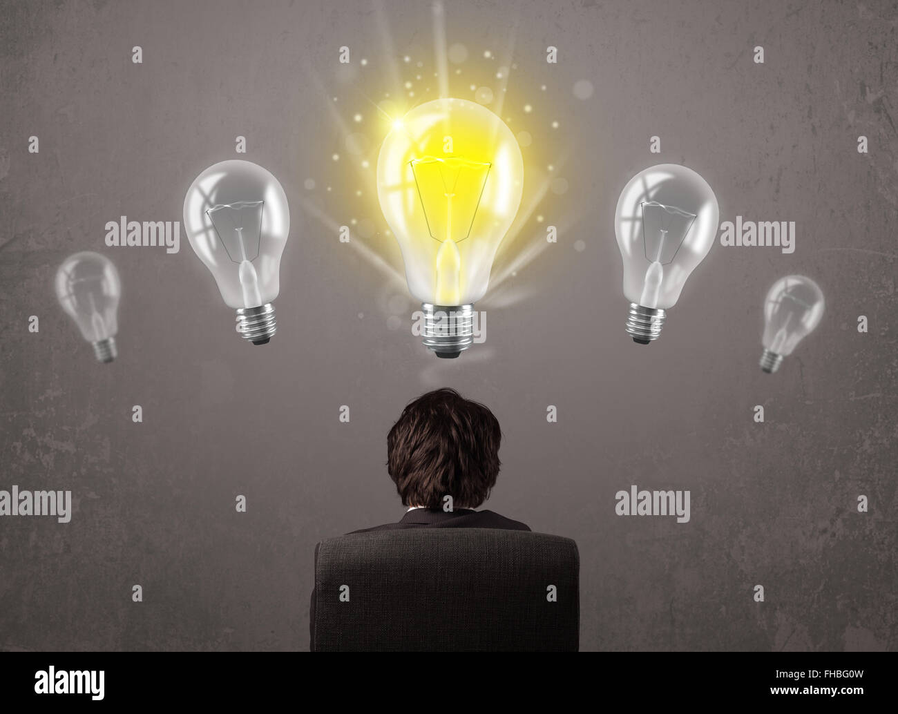 Business person having an idea light bulb concept Stock Photo - Alamy