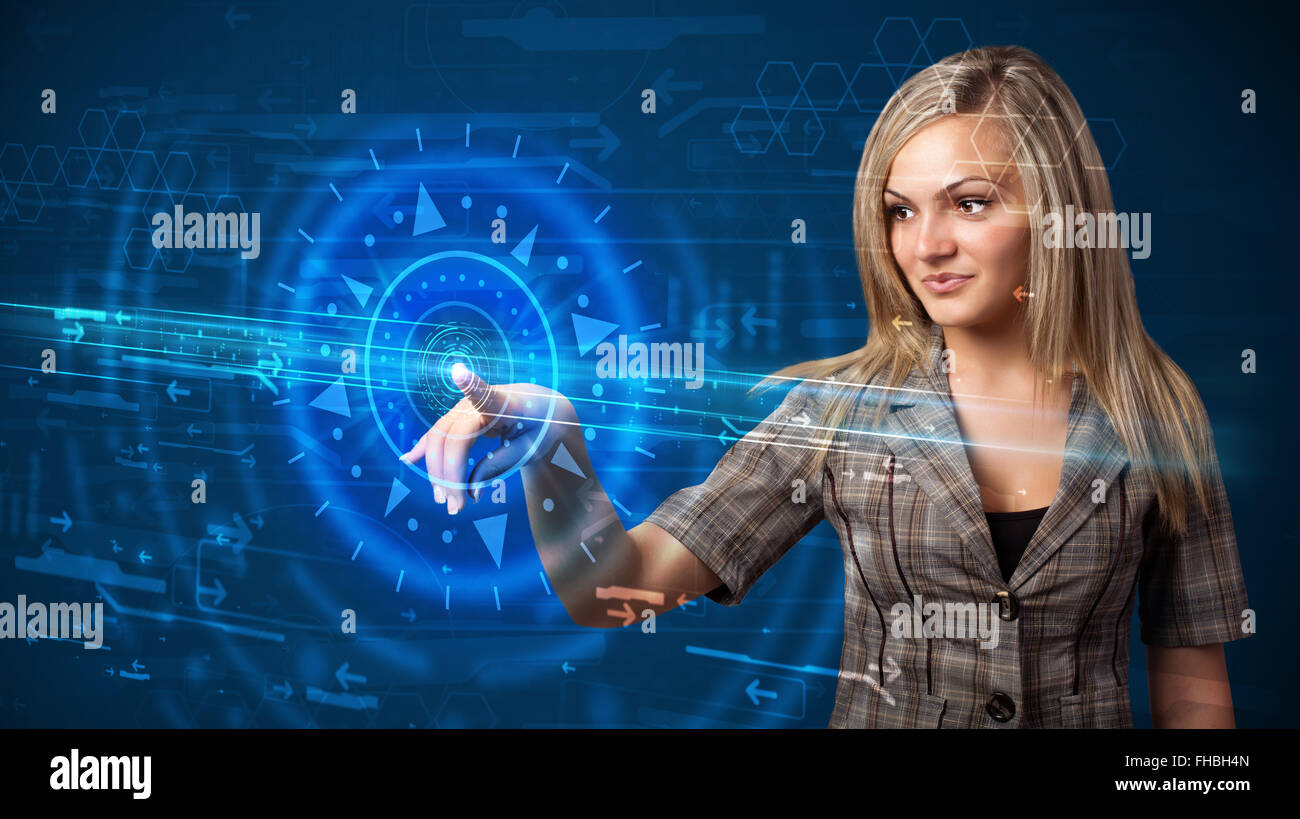 Young tech woman pressing high technology control panel screen concept ...