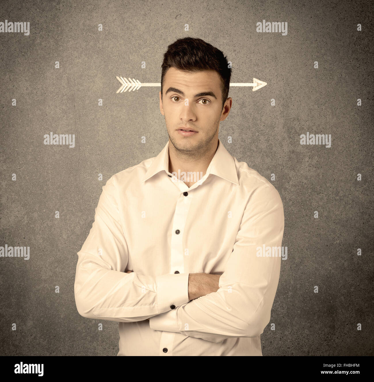 Young sales guy with arrow in the head Stock Photo - Alamy