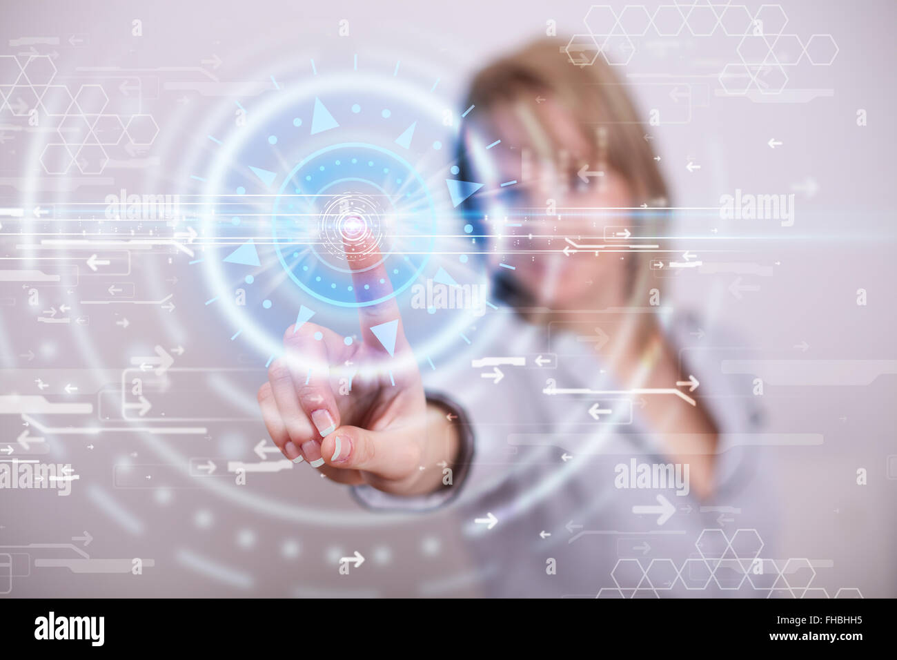 Young tech woman pressing high technology control panel screen concept ...