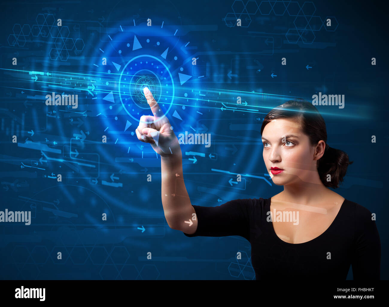 Young tech woman pressing high technology control panel screen concept ...