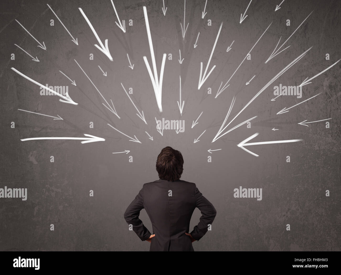 Business man with hand drawn arrows pointing at his head Stock Photo ...