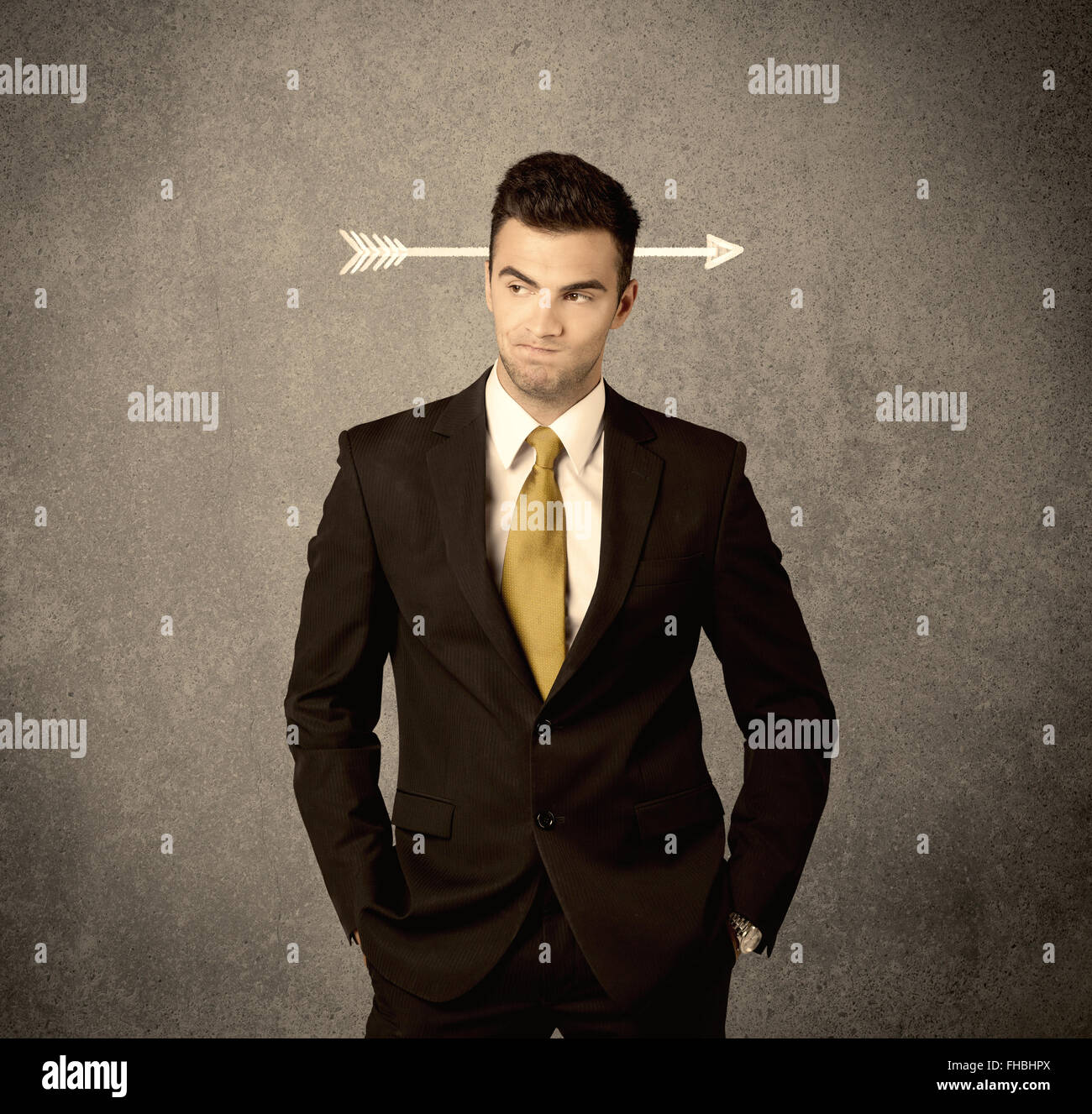 Young sales guy with arrow in the head Stock Photo - Alamy