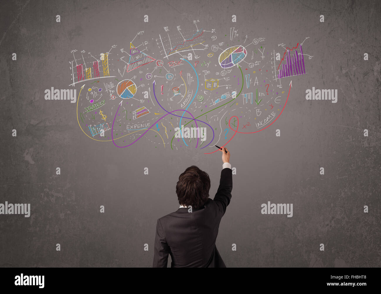 Young business man looking at sketches of graphs and symbols Stock ...