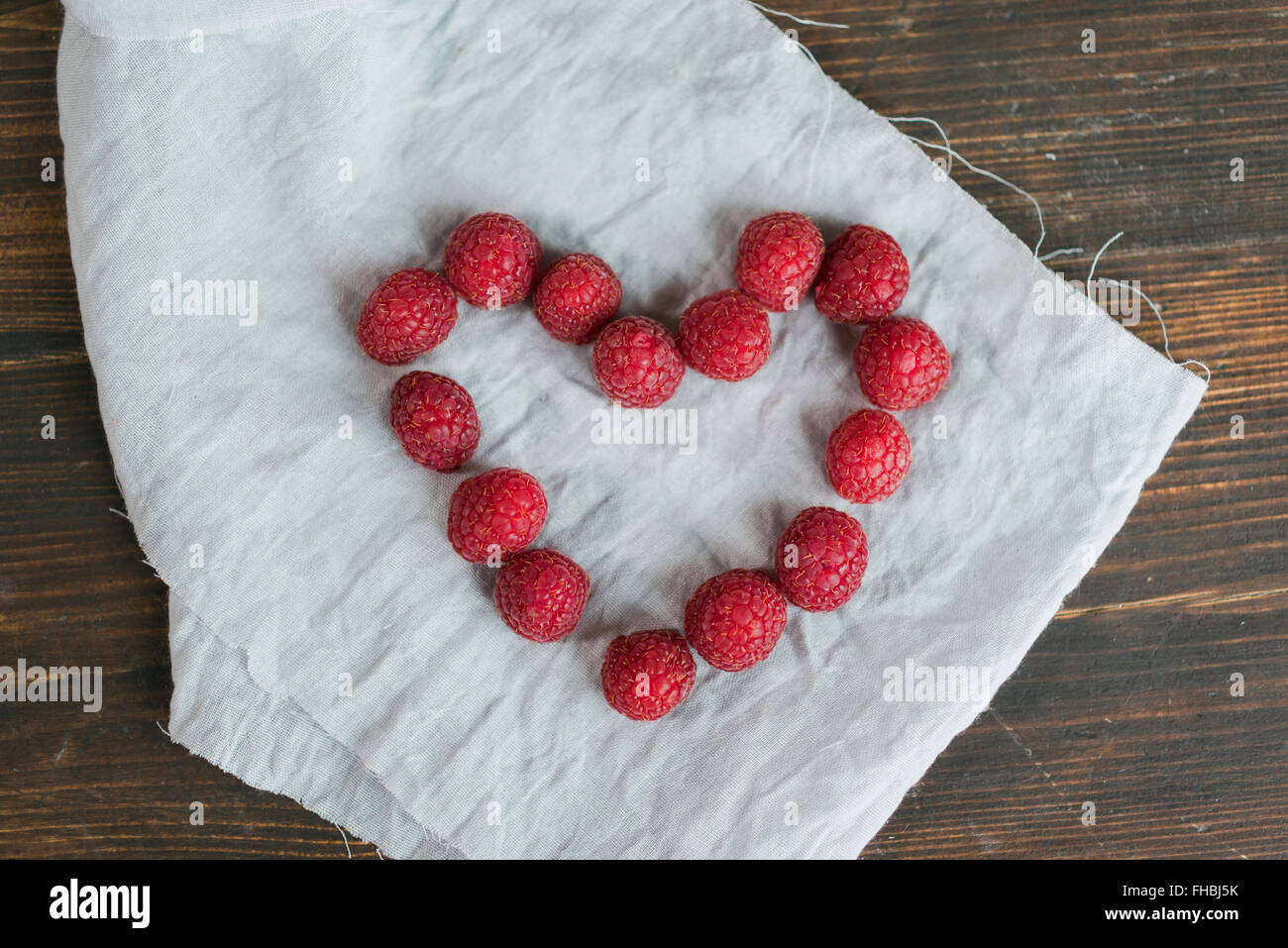 Heart shaped with raspberries Stock Photo - Alamy