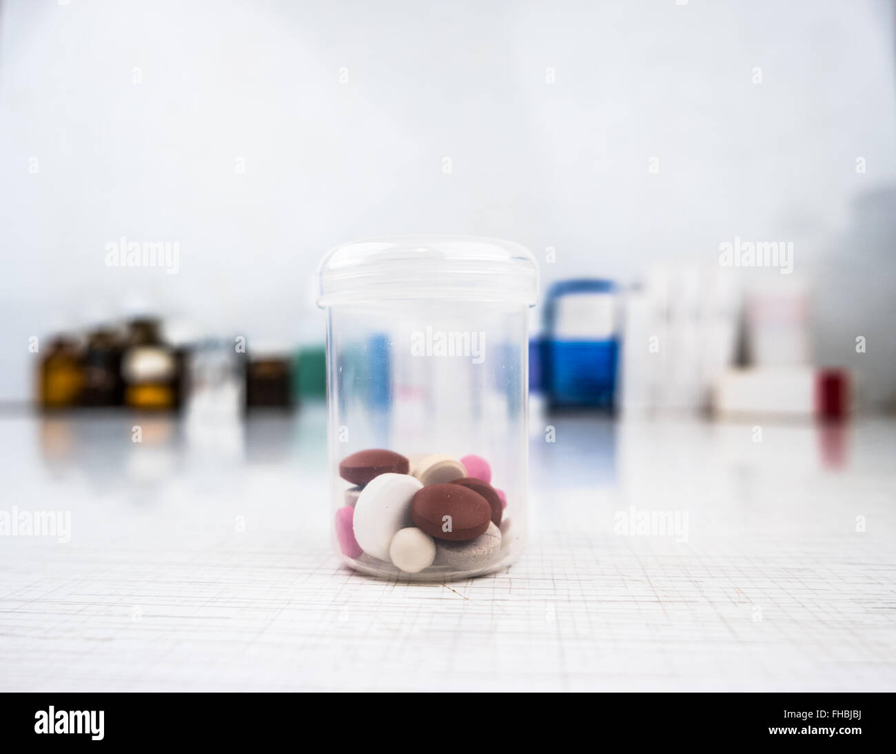 Drugs in a measuring cylinder Stock Photo - Alamy