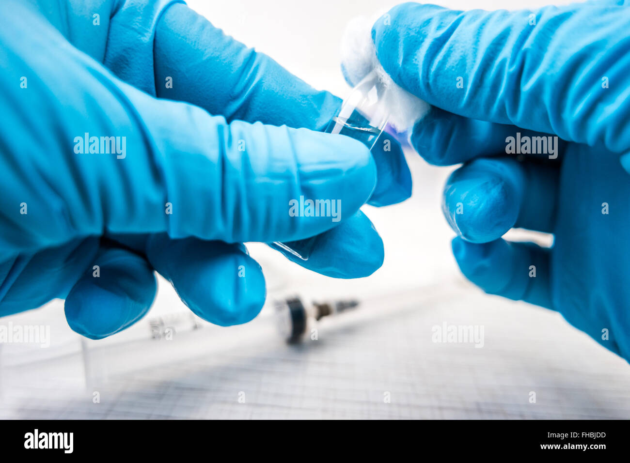 Doctor's hands in blue robber gloves Stock Photo - Alamy