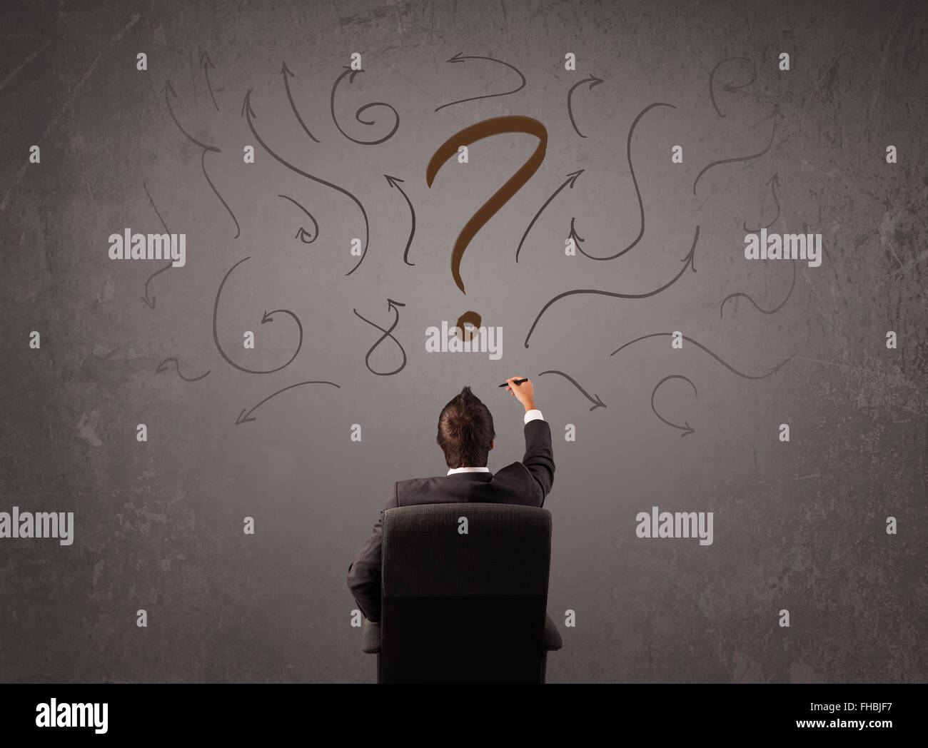 Business man looking at question mark sketch Stock Photo - Alamy
