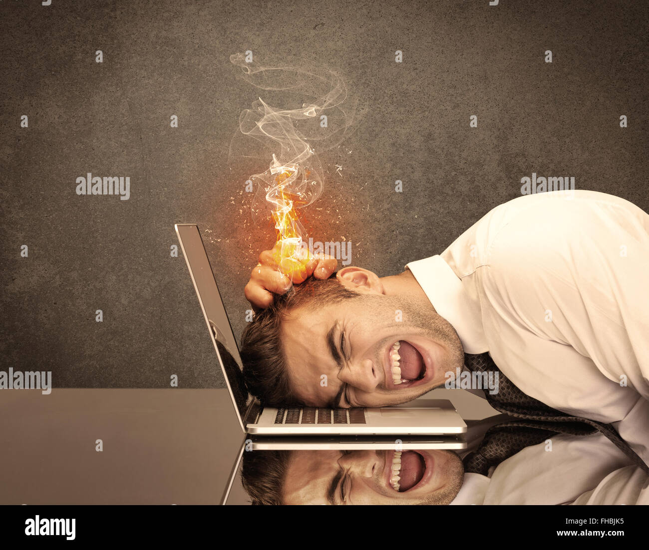 Sad business person's head catching fire Stock Photo - Alamy