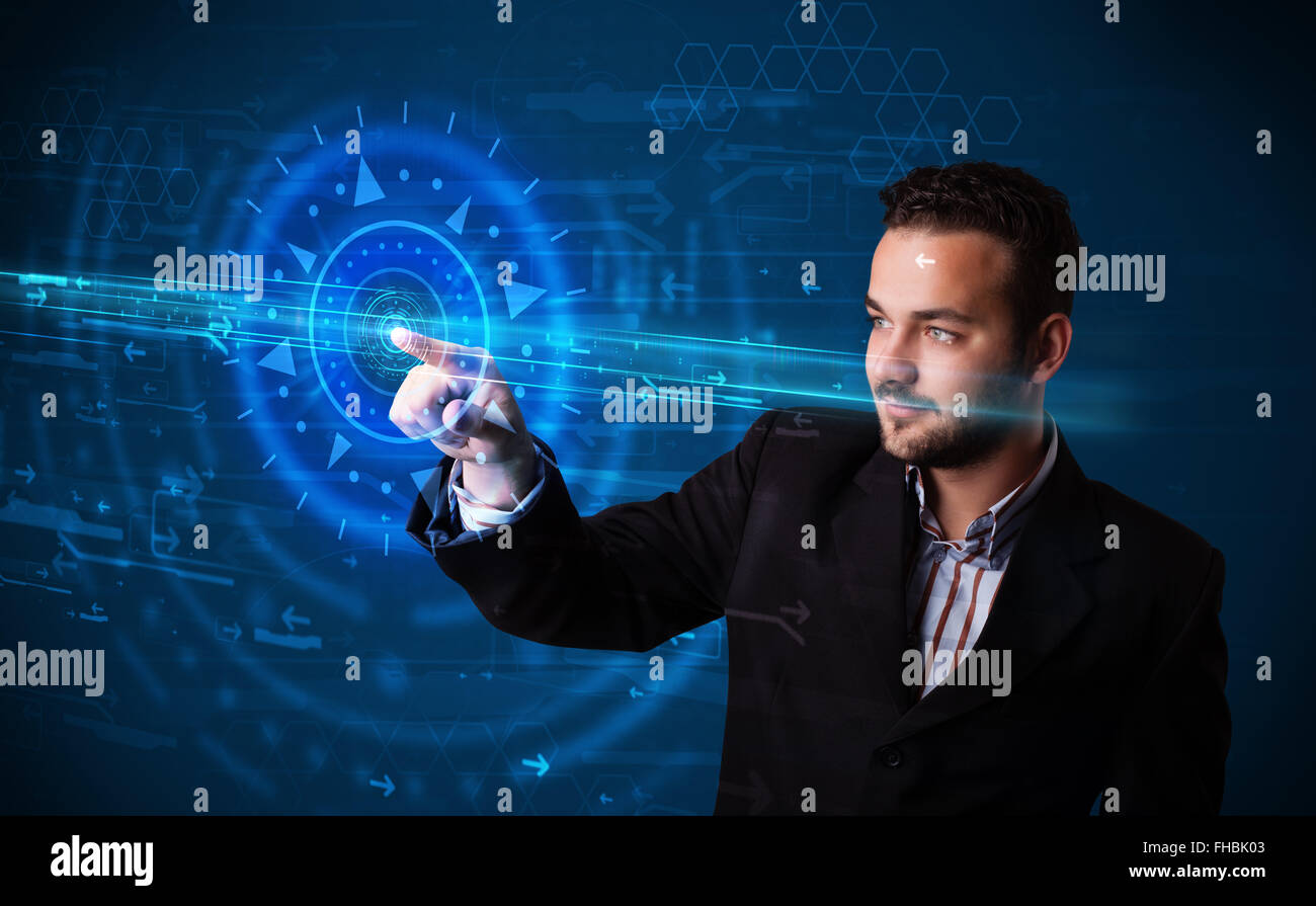 Handsome tech guy pressing high technology control panel screen concept ...