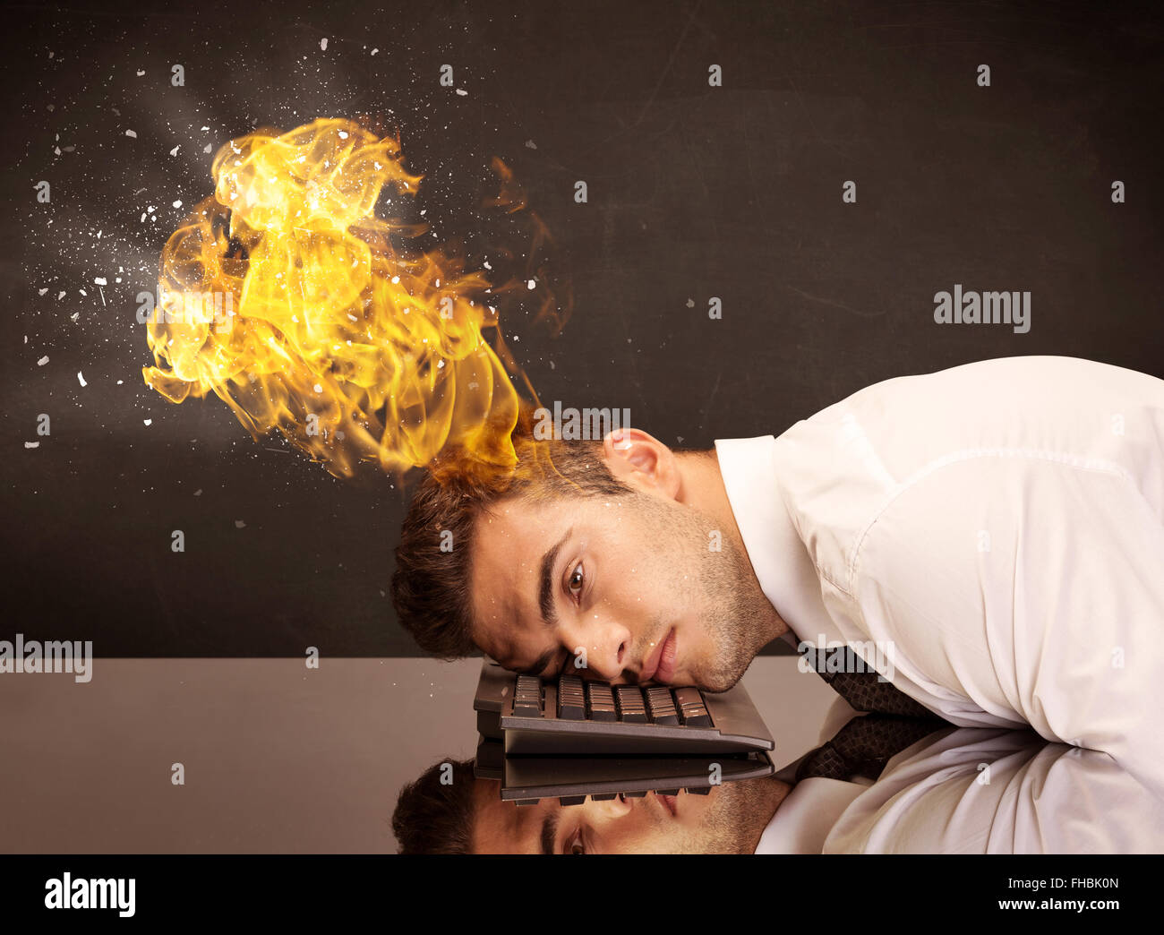 Stressed business man's head is burning Stock Photo - Alamy