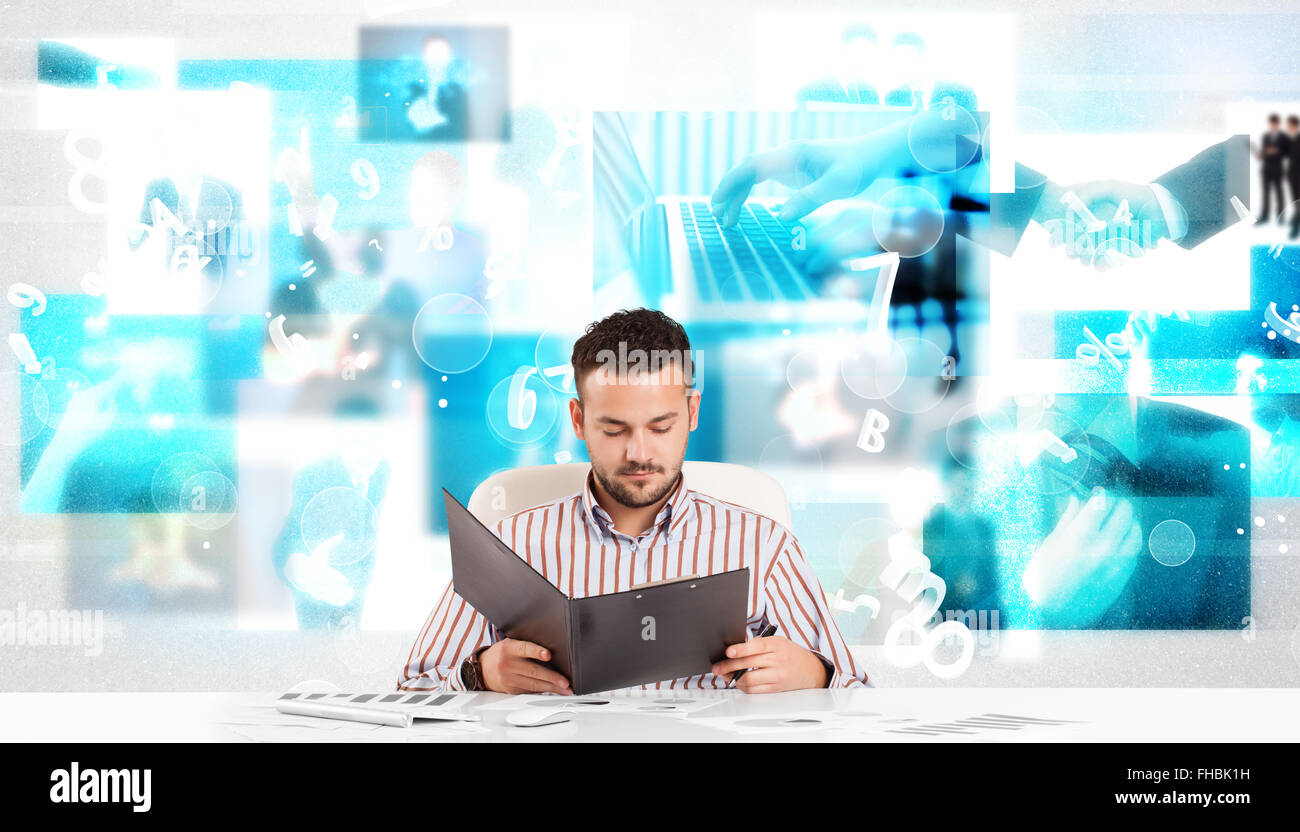 Business person at desk with modern tech images at background Stock ...