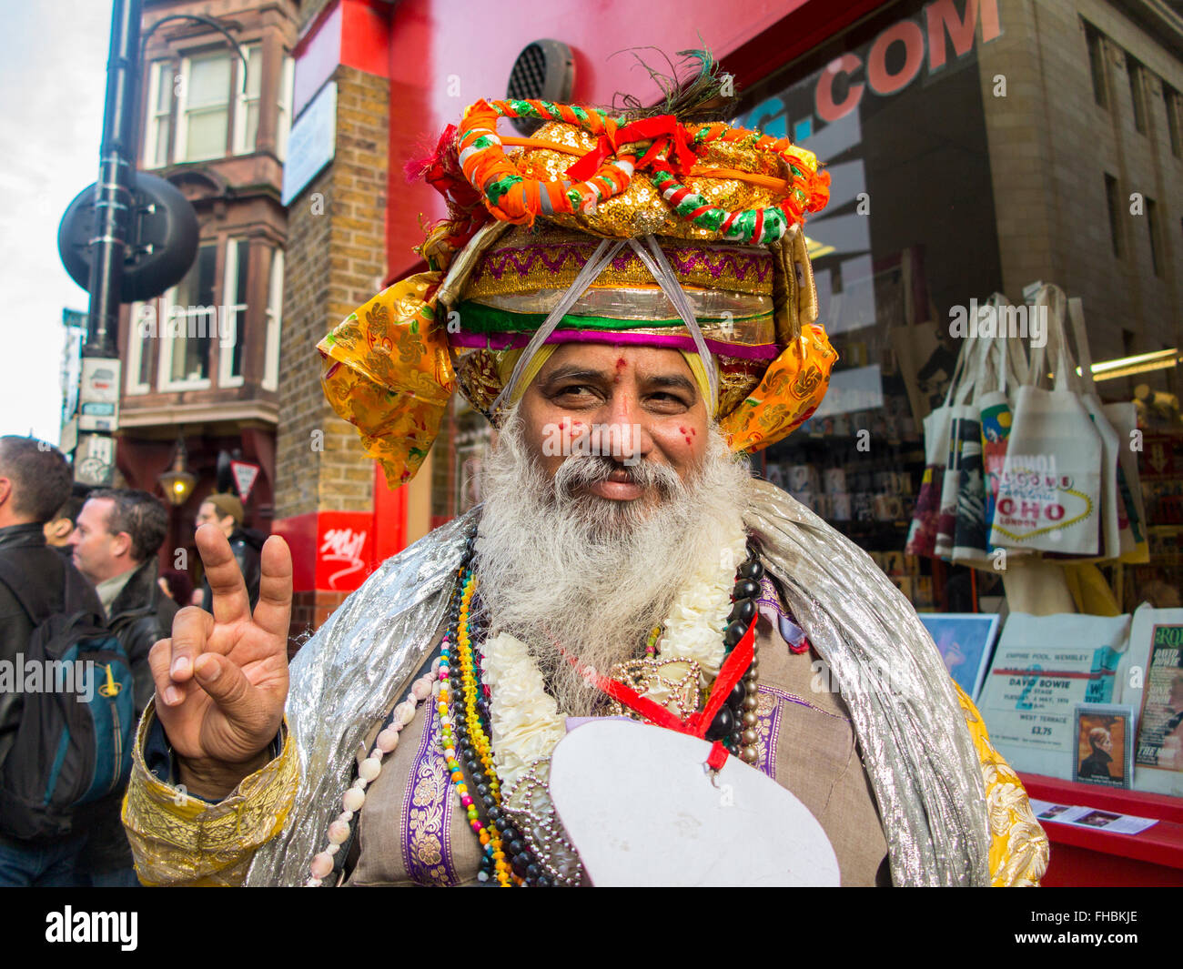An Indian man in brightly coloured clothes at the London Fashion Week ...