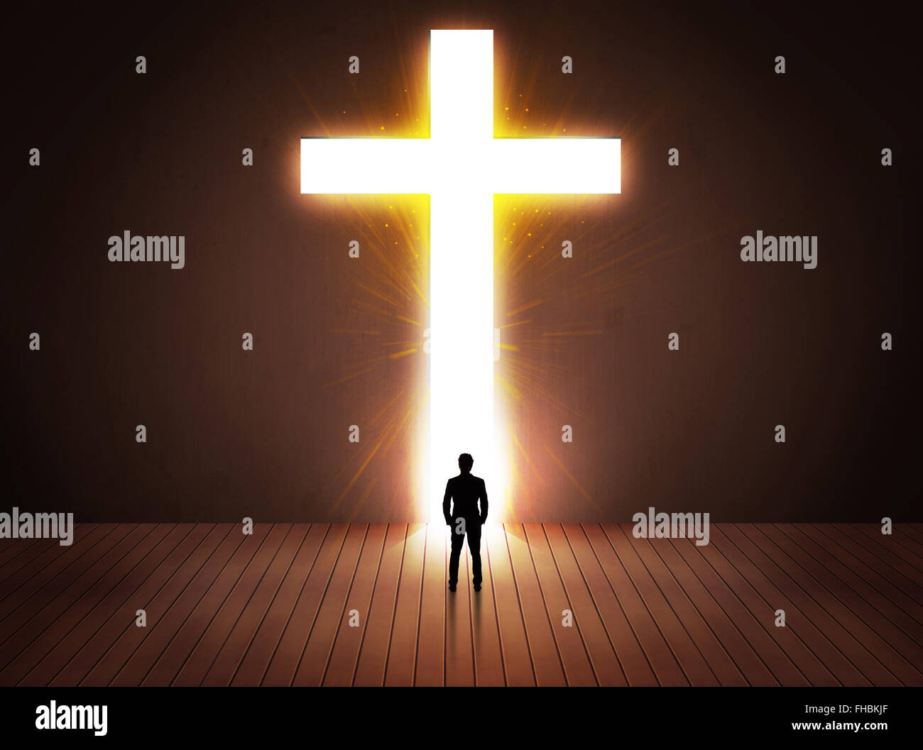 Man looking at bright cross sign Stock Photo - Alamy