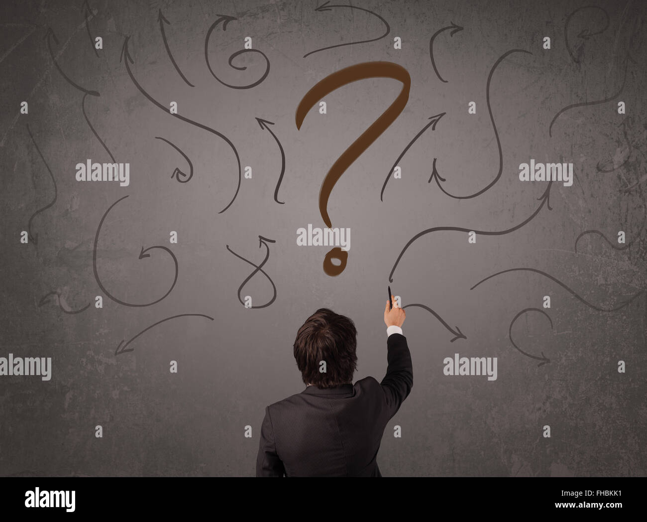 Business man looking at question mark sketch Stock Photo - Alamy