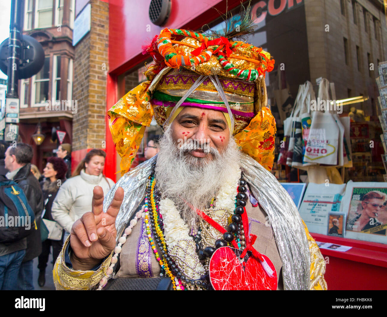 An Indian man in brightly coloured clothes at the London Fashion Week ...