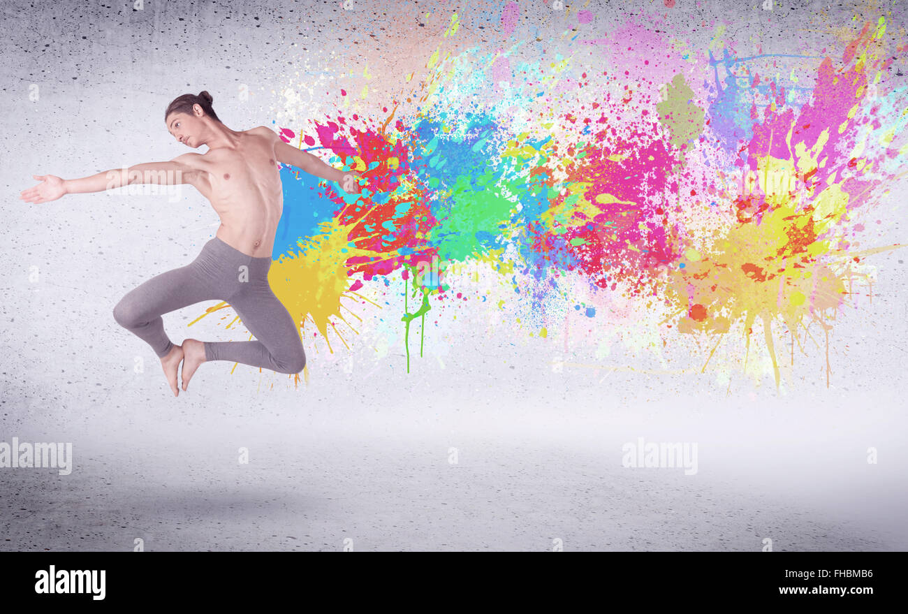 Modern street dancer jumping with colorful paint splashes Stock Photo ...