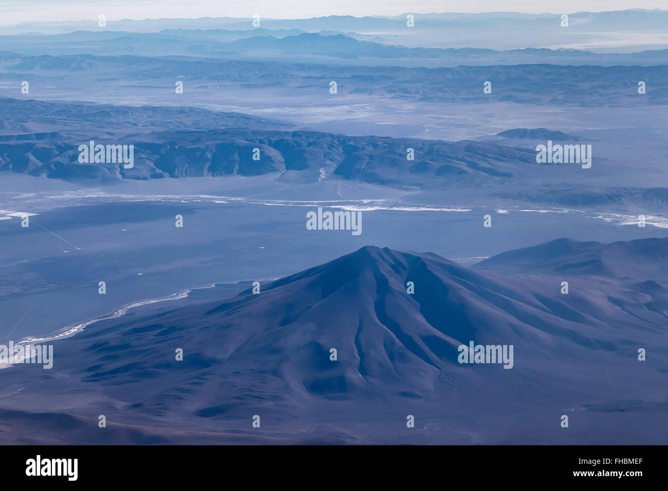 Aerial view from window plane of Andes mountains in the fly which goes ...
