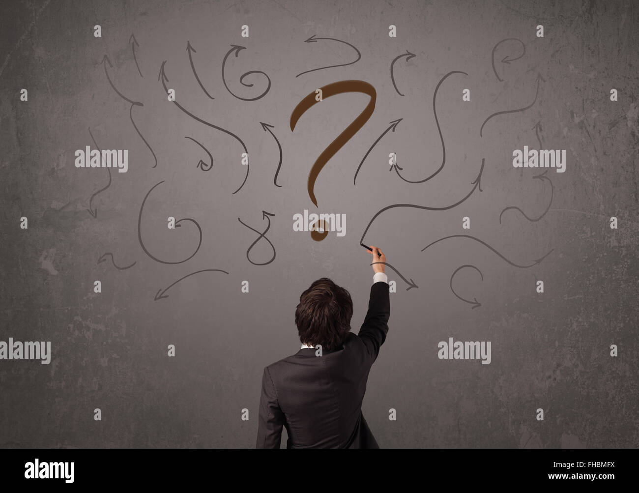 Business man looking at question mark sketch Stock Photo - Alamy