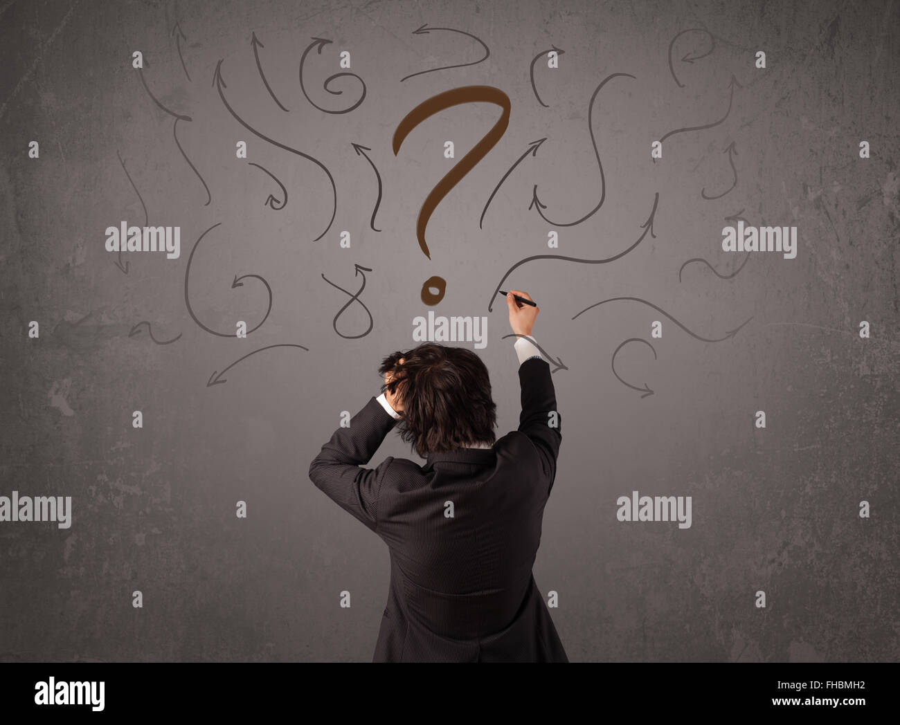 Business man looking at question mark sketch Stock Photo - Alamy
