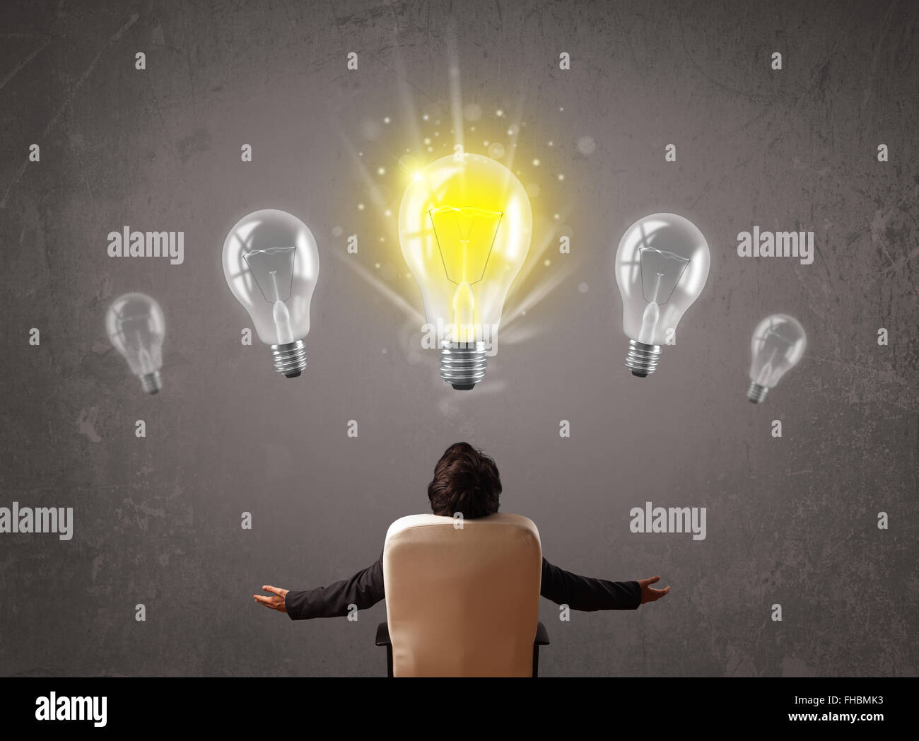 Business person having an idea light bulb concept Stock Photo - Alamy