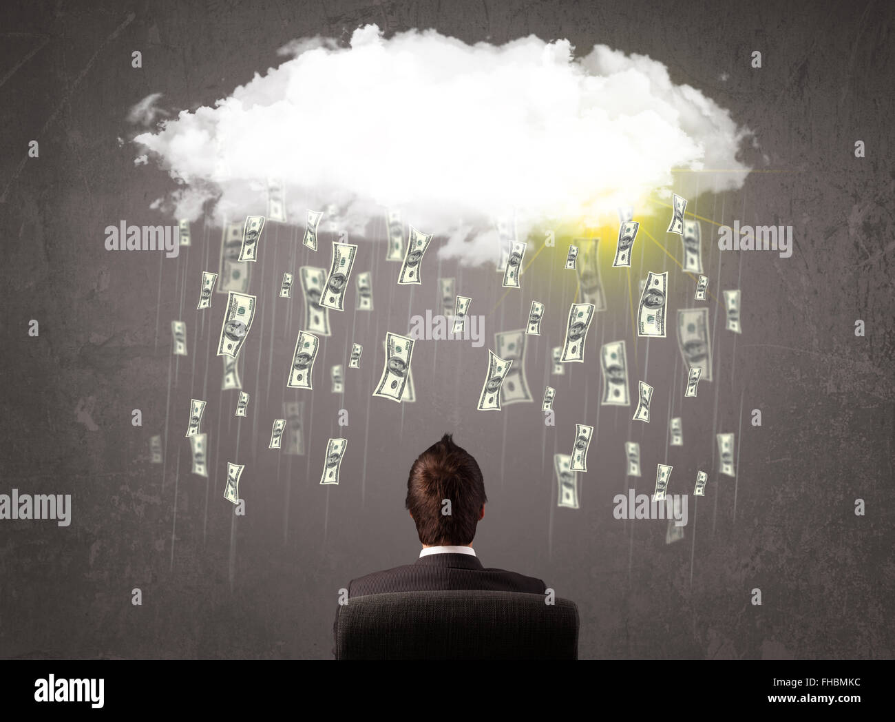 Business man in suit looking at cloud with falling money Stock Photo ...