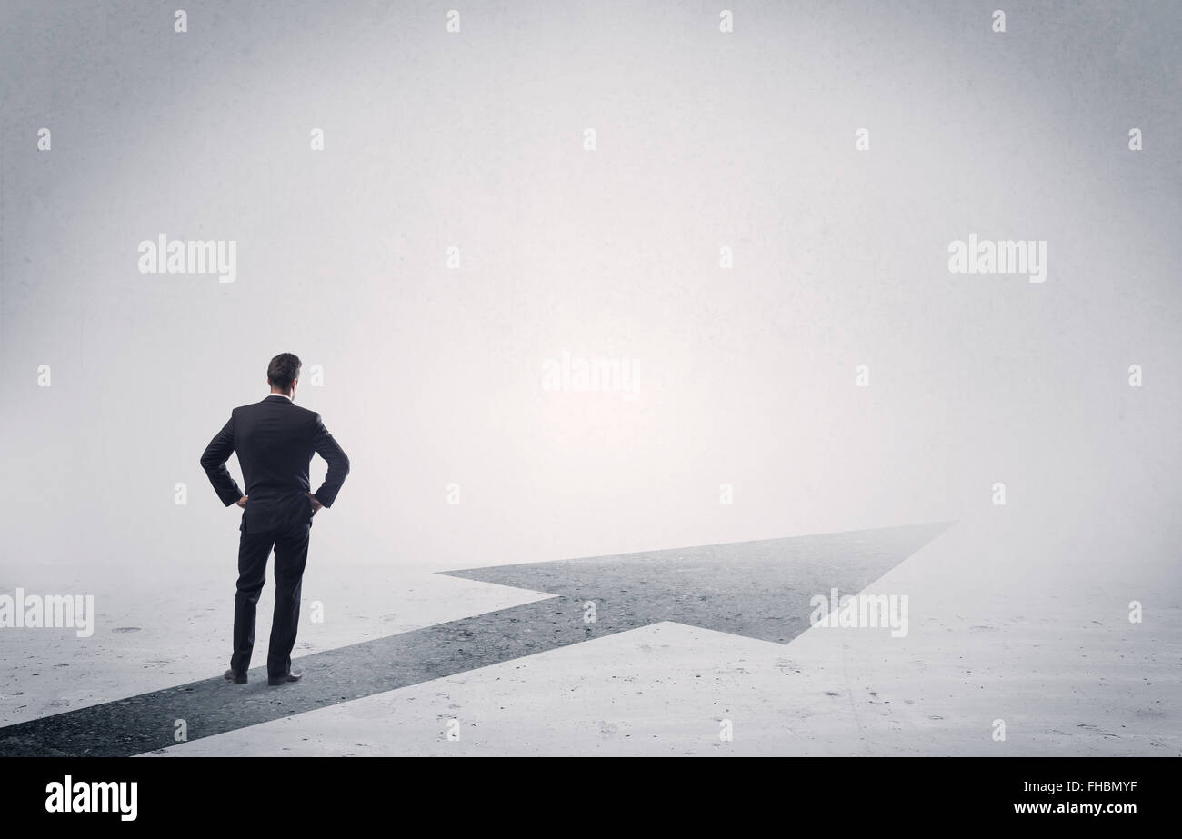Standing salesman looking ahead with arrow Stock Photo - Alamy