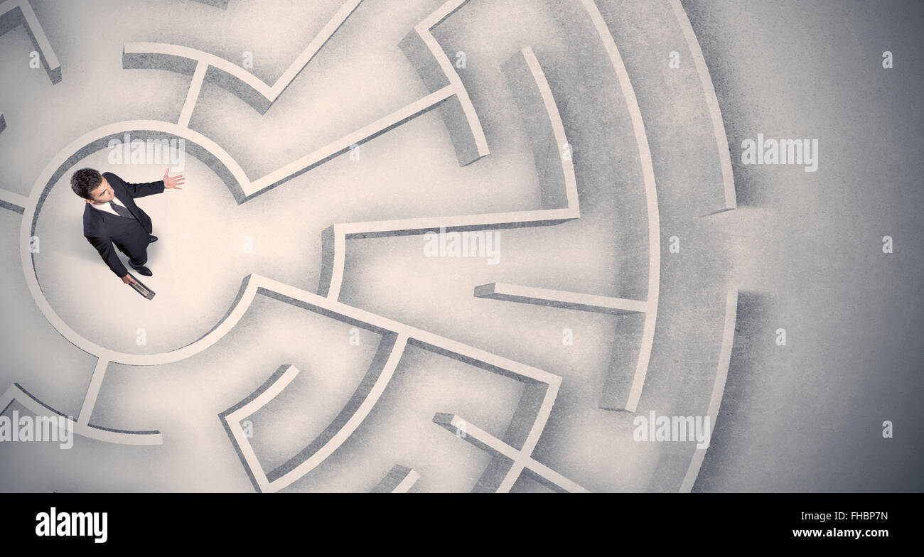 Business man trapped in a circular maze Stock Photo - Alamy