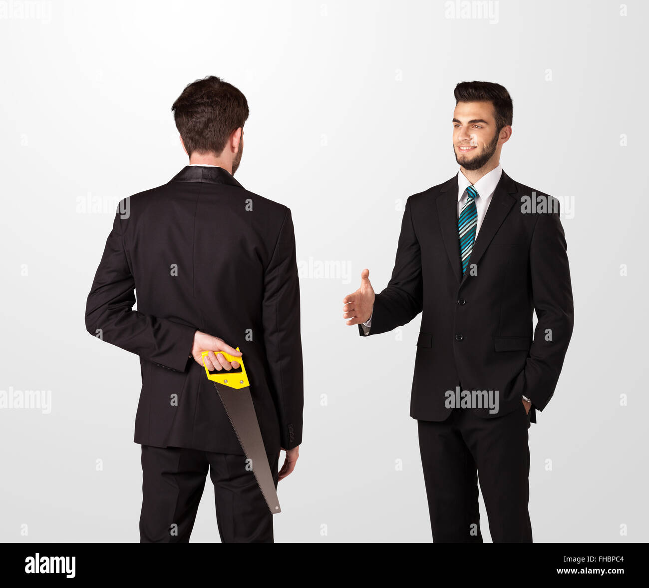 Two businessman shake hands Stock Photo - Alamy