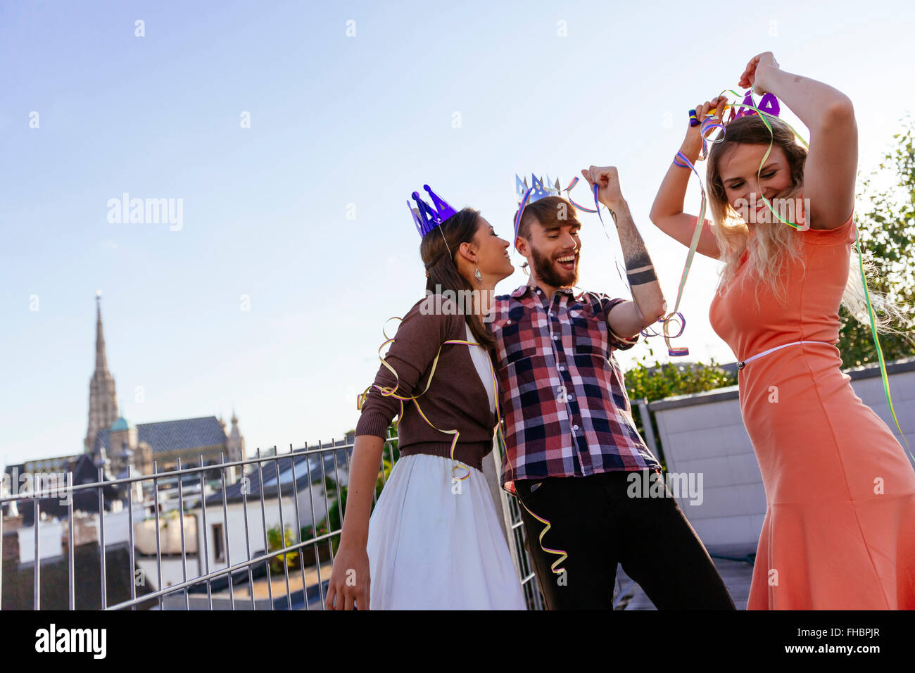 Austria, Vienna, Young people having a party on rooftop terrace Stock ...