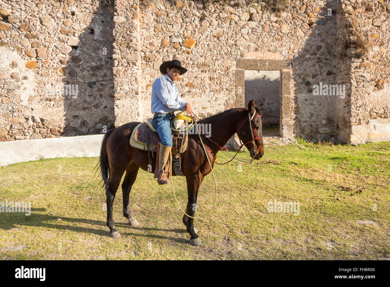 A Mexican charro or cowboy on his horse at a hacienda ranch in Alcocer ...