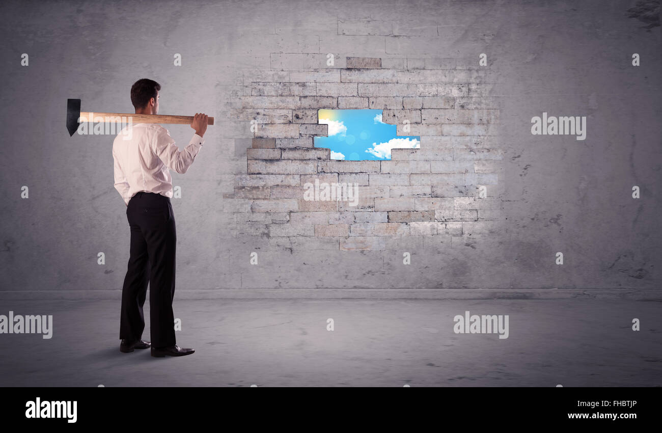 Business man hitting brick wall with hammer Stock Photo - Alamy