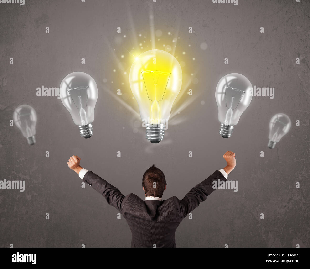 Business person having an idea light bulb concept Stock Photo - Alamy
