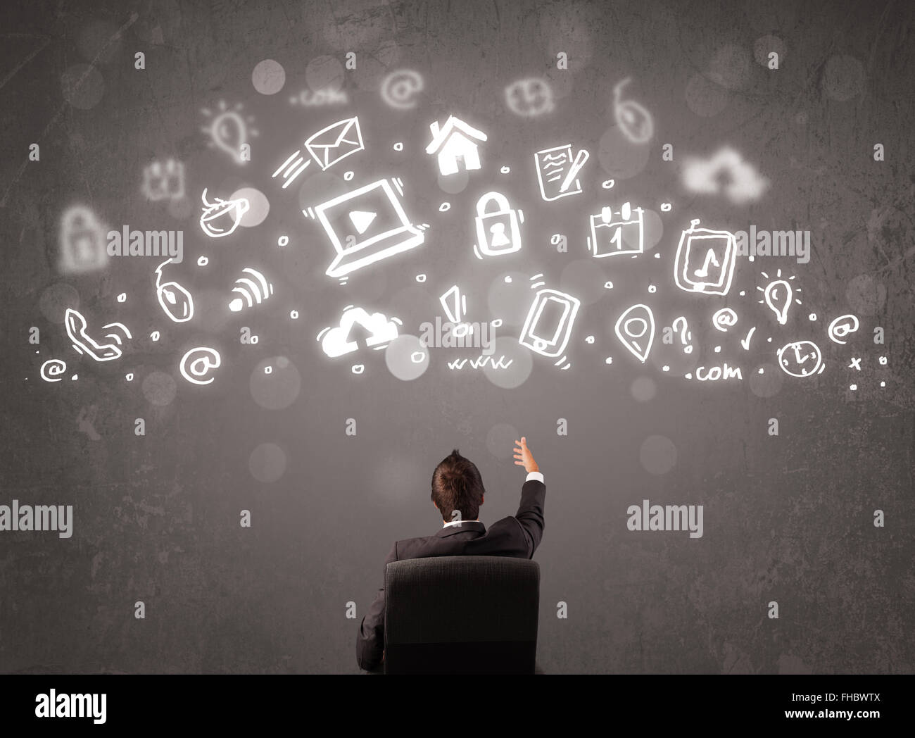 Business man looking at modern icons and symbols Stock Photo - Alamy