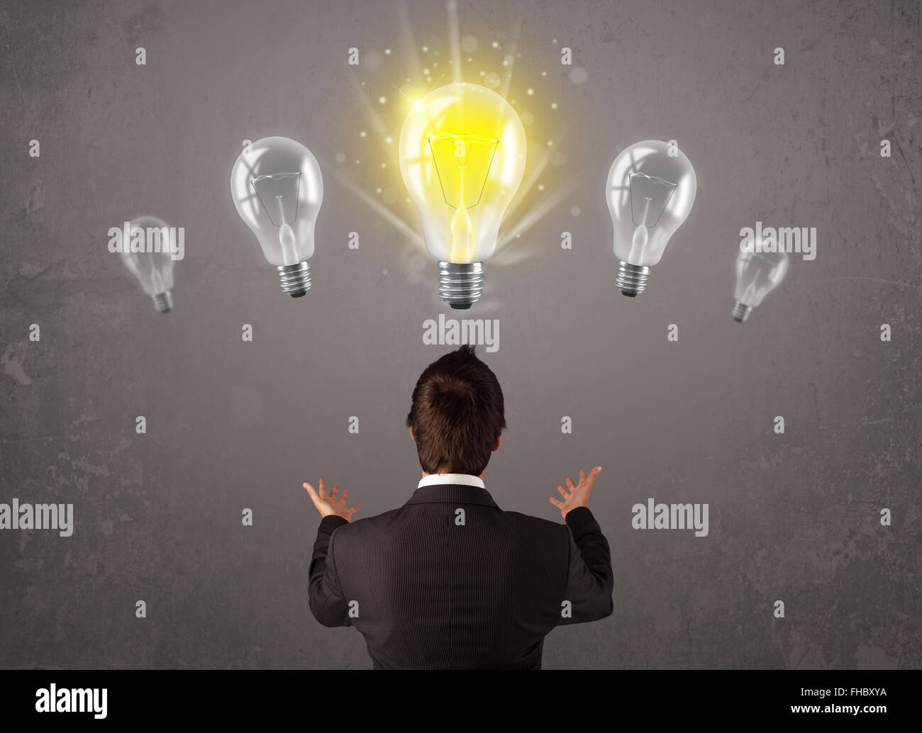 Business person having an idea light bulb concept Stock Photo - Alamy