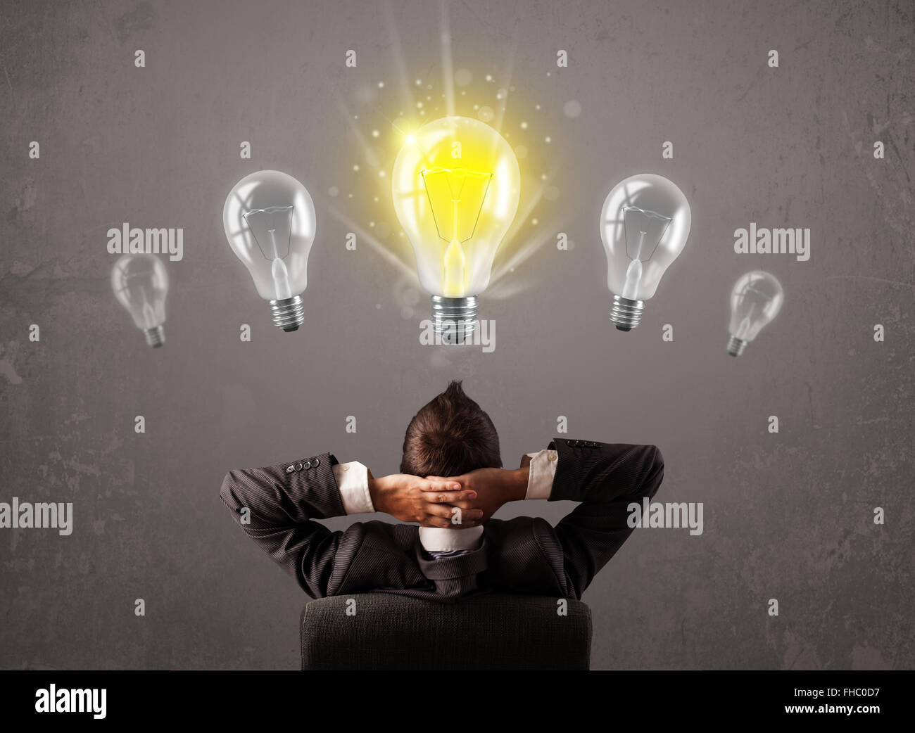Business person having an idea light bulb concept Stock Photo - Alamy